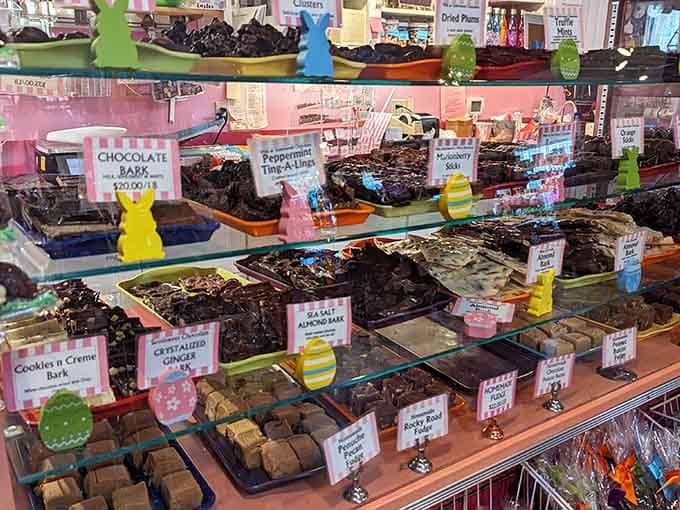 Glass shelves showcase chocolate bark varieties like edible art in a deliciously decadent gallery.