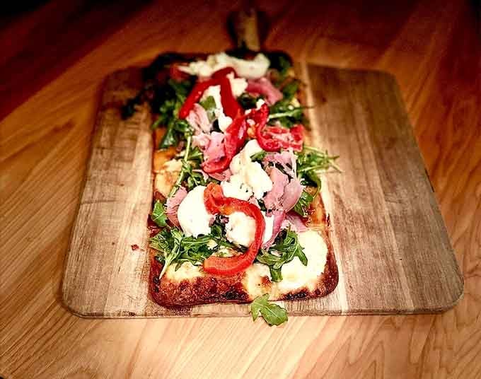 Flatbread loaded with fresh mozzarella and prosciutto, because sometimes pizza needs to dress up fancy.