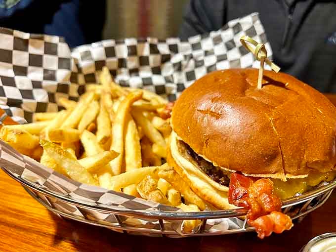 A burger this stacked requires architectural engineering skills just to figure out how to take that first bite.