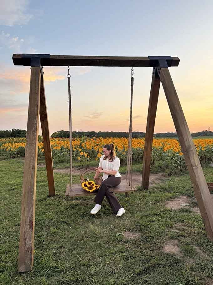 Golden hour at the swing with sunflowers behind you: basically the universe's way of saying you deserve nice things.