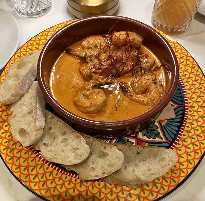 Shrimp Di Ablo arrives in a bowl that's practically glowing with flavor, like edible sunshine with a spicy attitude.