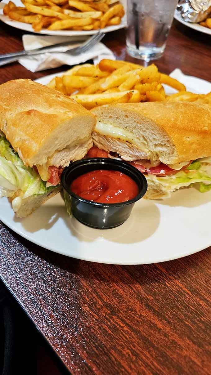That toasted ciabatta is practically bursting with flavor, and those oregano fries are the supporting cast stealing the show.