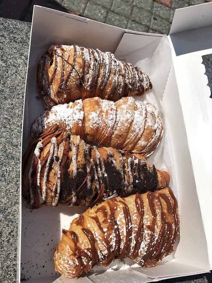 Lobster tails that contain zero seafood but 100% flaky, cream-filled pastry perfection, drizzled with chocolate and dusted with powdered sugar dreams.