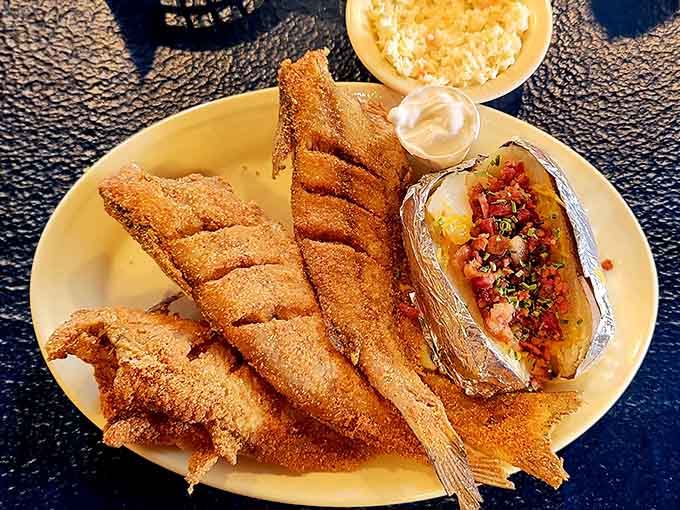 Whole fried catfish with all the fixings, because sometimes you need to commit fully to the experience and embrace the bones.
