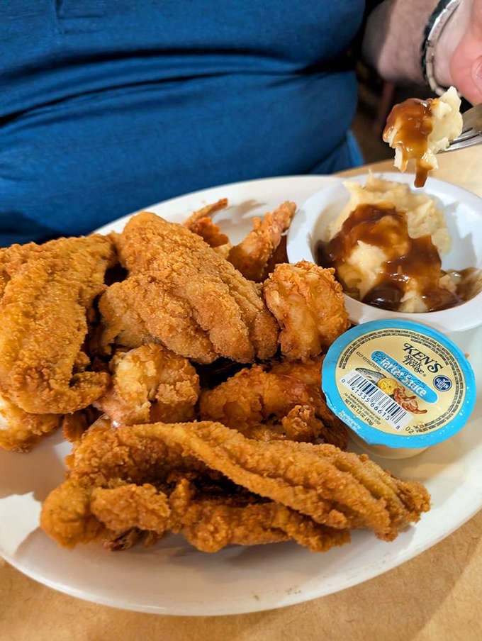 Golden fried catfish and shrimp create a crispy symphony that would make any Southern grandmother nod with approval.