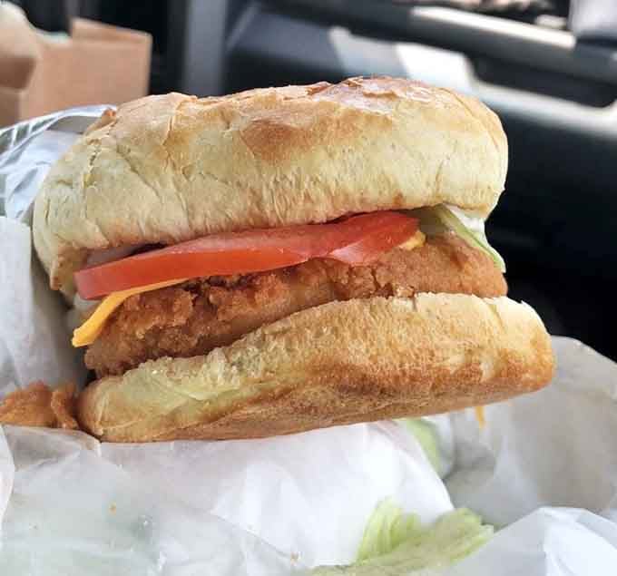 A fried fish sandwich so substantial it needs architectural support, and your appetite needs to match.