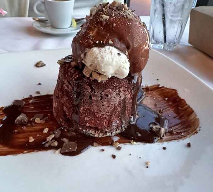 The Hot Chocolate Lava Cake towers like a delicious monument to the phrase "I'll just have a bite."