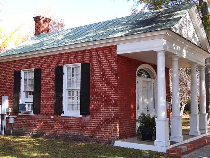 Red brick and white columns: the classic combination that never goes out of style, unlike your nephew's fashion choices.