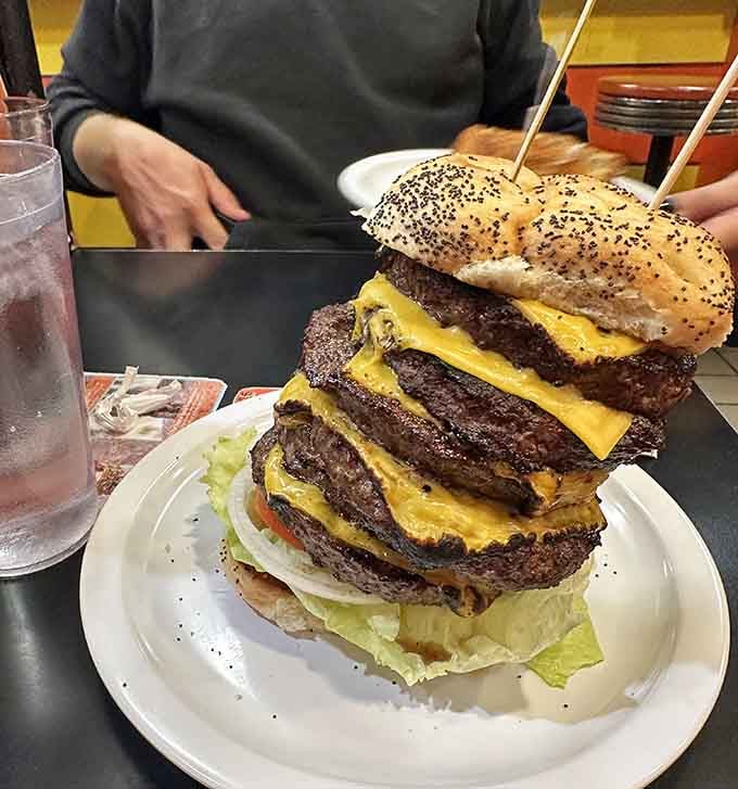 Five patties of pure ambition stacked higher than most people's retirement plans and twice as satisfying.