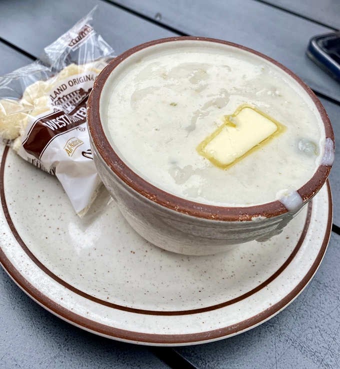 That pat of butter melting into creamy chowder is pure coastal comfort in a bowl.