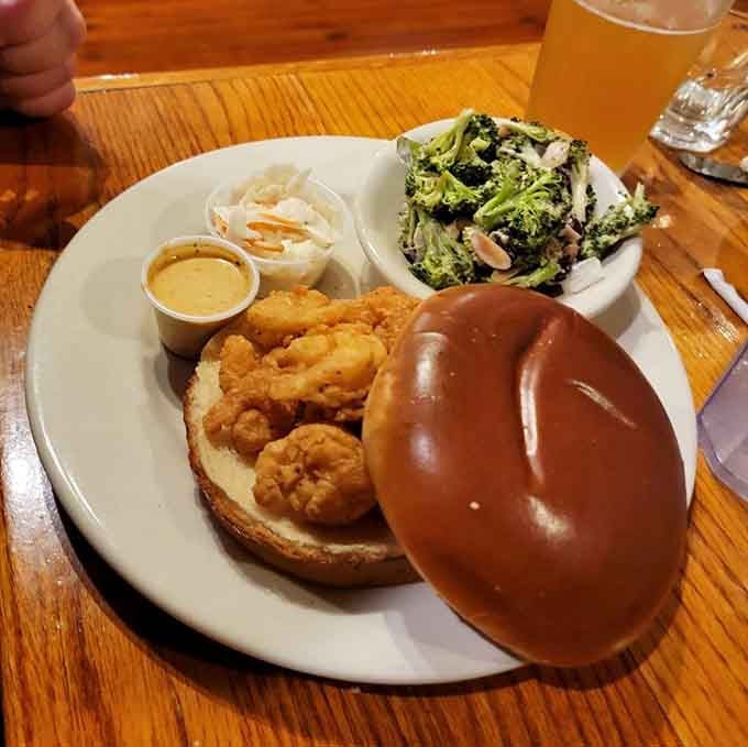Golden fried seafood nestled on a pretzel bun proves that sometimes the best innovations come from coastal Carolina creativity.