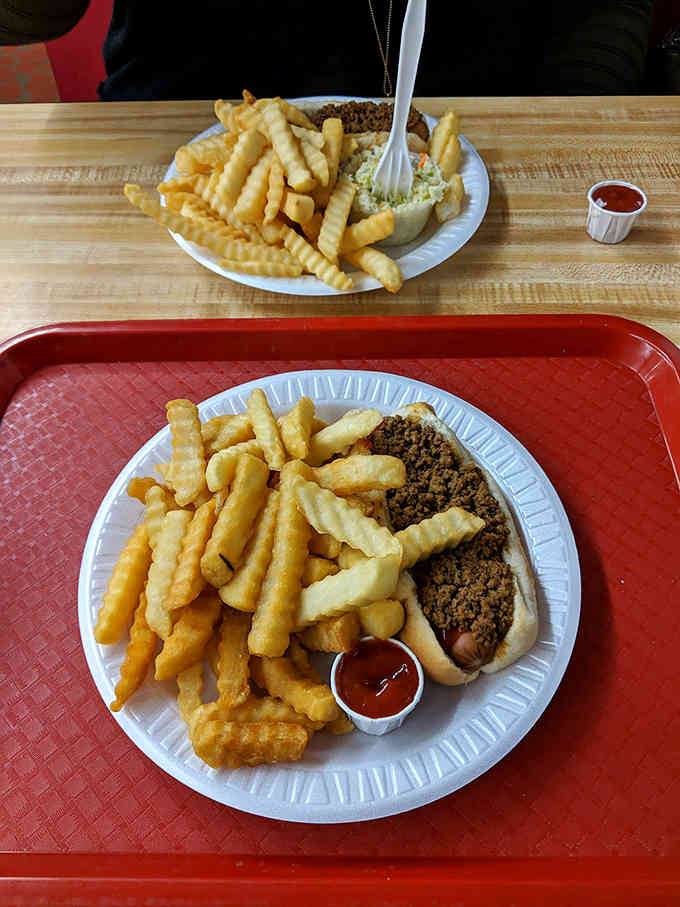 This chili dog proves that sometimes the messiest foods deliver the most memorable flavor experiences imaginable.