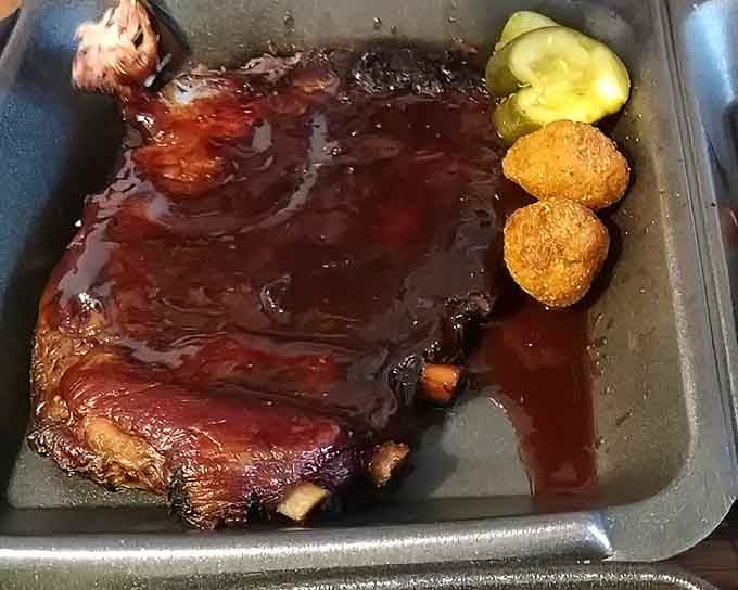 That mahogany glaze and meat pullback tell you everything about hours spent in the smoker doing honest work.