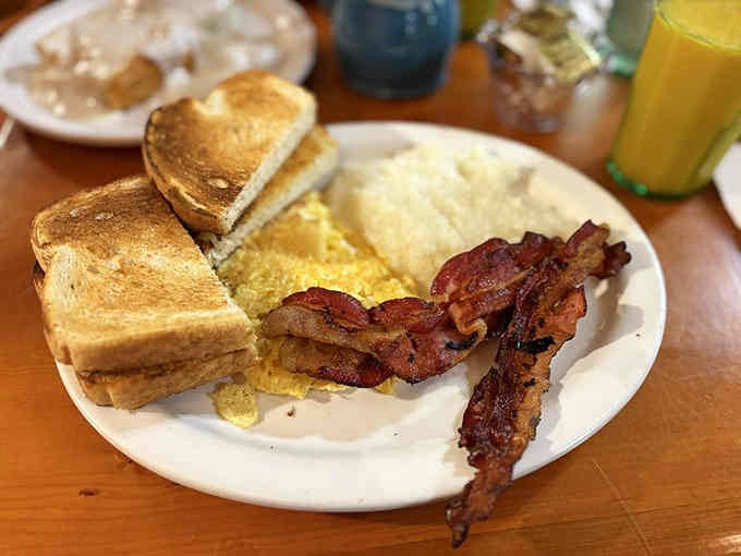 Crispy bacon, perfectly cooked eggs, and toast ready for butter: this is what mornings were invented for, folks.