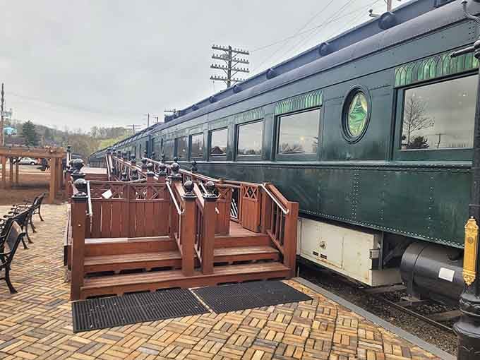 Vintage railway cars line up like distinguished guests at a garden party, each one more charming than the last.