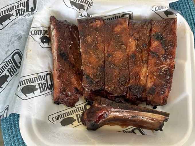 Ribs with that gorgeous bark and perfect smoke ring prove that patience and wood smoke create actual magic.