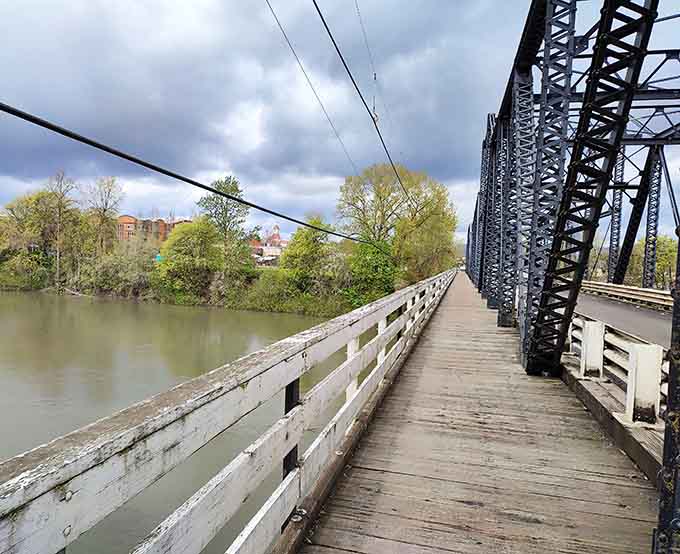Steel beams frame your river views like an industrial art installation that actually makes sense to everyone.