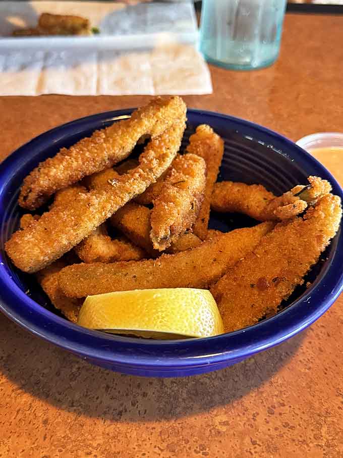 Golden-fried fish with a squeeze of lemon: simple pleasures executed to crispy, flaky perfection.