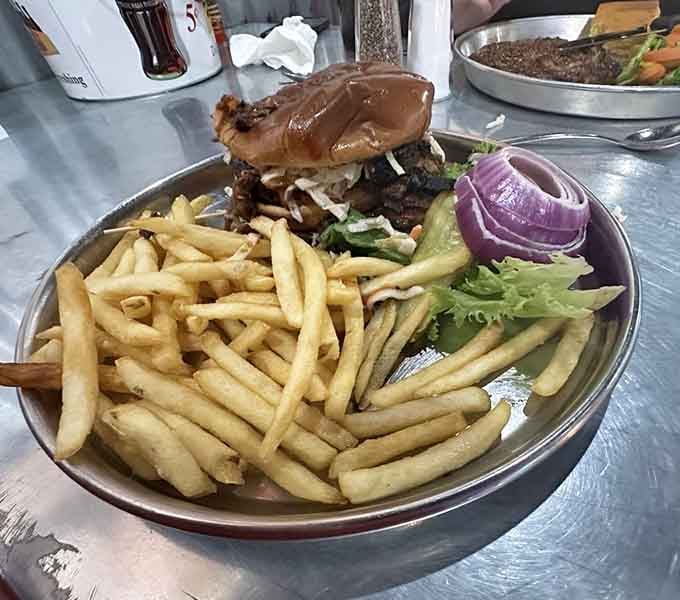 The Smoked Longhorn Burger arrives stacked higher than your road trip expectations, and somehow exceeds them anyway.