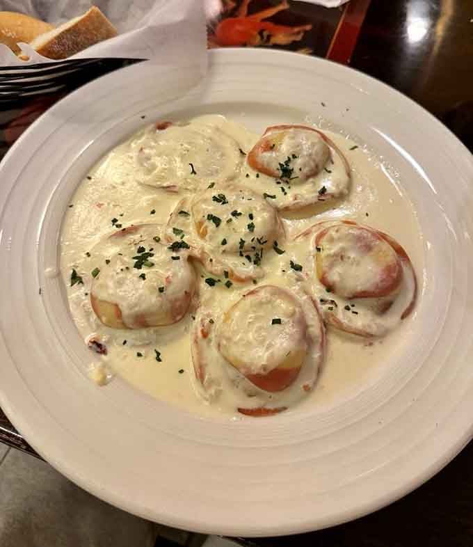 Lobster ravioli swimming in cream sauce: proof that sometimes the fanciest dishes are also the most comforting.