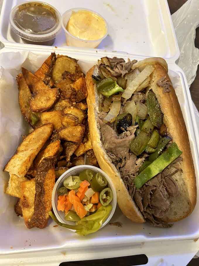 Italian beef piled high with peppers, golden fries, and pickled veggies is comfort food done absolutely right.