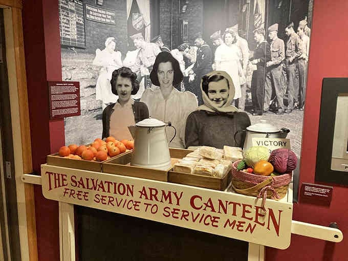 Behind this simple canteen table, volunteers served thousands daily with smiles, coffee, and unwavering dedication to our troops.