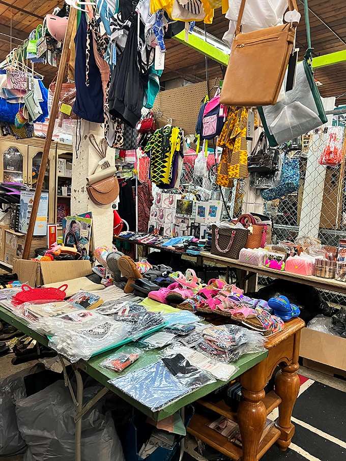 Handbags, accessories, and treasures galore create a colorful chaos that somehow makes perfect sense to dedicated flea market enthusiasts.