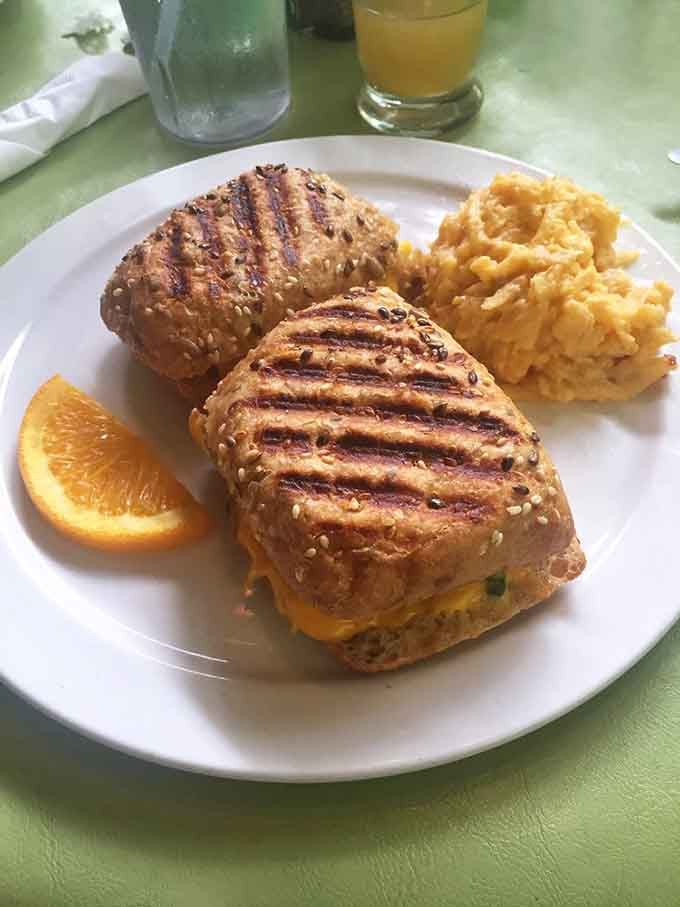 These breakfast paninis arrive with perfect grill marks and enough pimento cheese to fuel your entire morning.