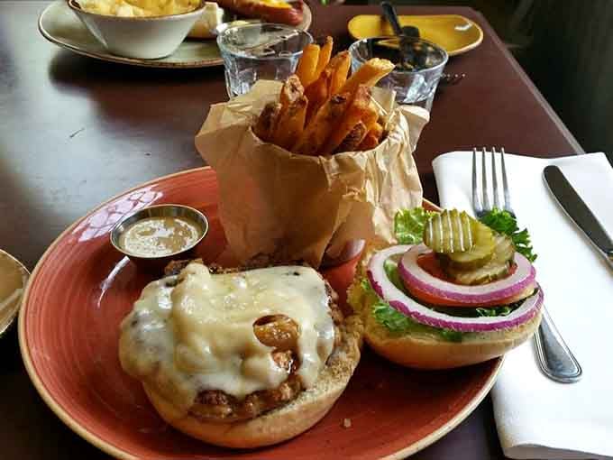 That's a burger with all the fixings served open-faced, because sometimes you need to admire your meal before diving in headfirst.