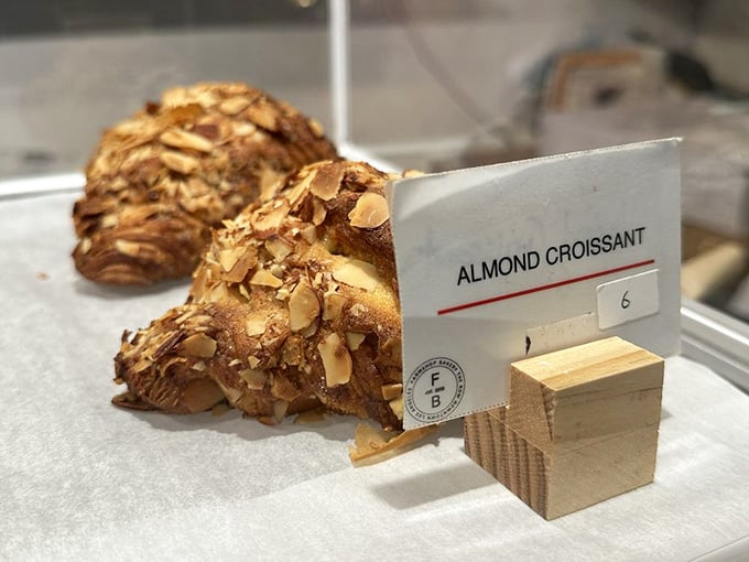 Almond croissant so flaky and golden, it's basically edible architecture that belongs in a pastry museum.