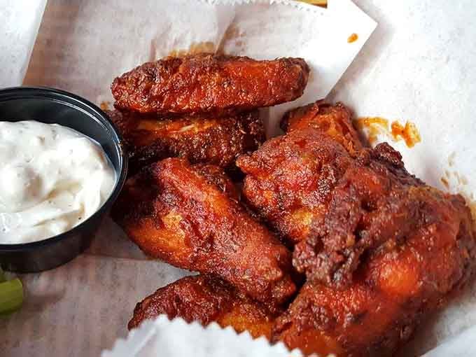These wings have achieved that perfect mahogany color that makes grown adults forget their table manners entirely.