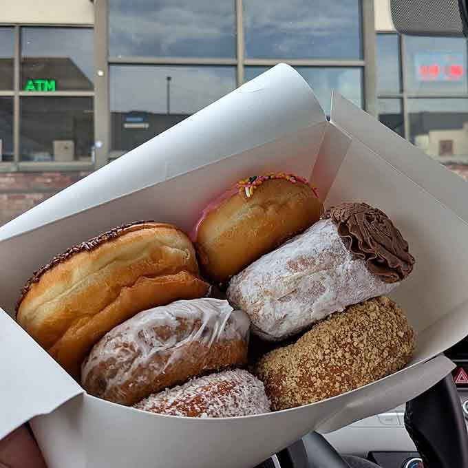 A box of assorted donuts that looks like the starting lineup of an all-star pastry team.