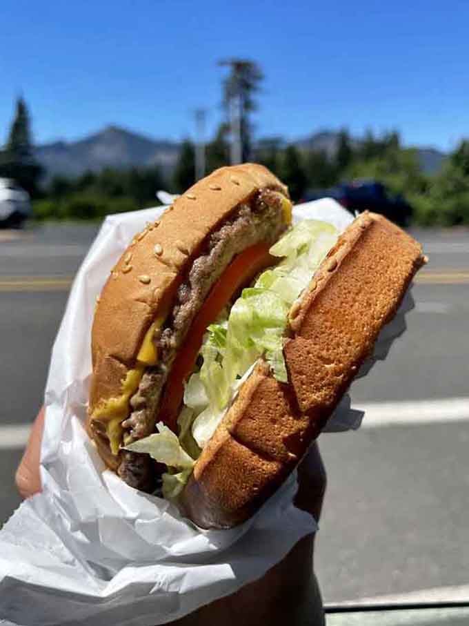 Sesame seed bun, melted cheese, crispy bacon, lettuce, this burger means business in the best way.
