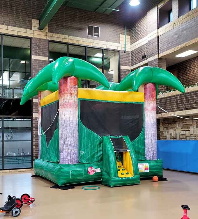 Nothing says "tropical paradise" quite like a palm tree bounce house in the middle of suburban Minnesota winters.