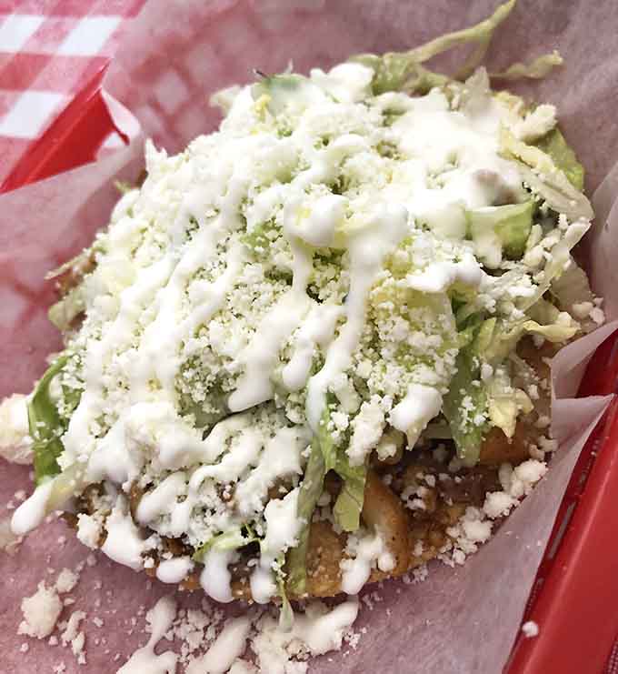 This huarache topped with crema and cheese is comfort food that doesn't need a fancy dining room to taste incredible.