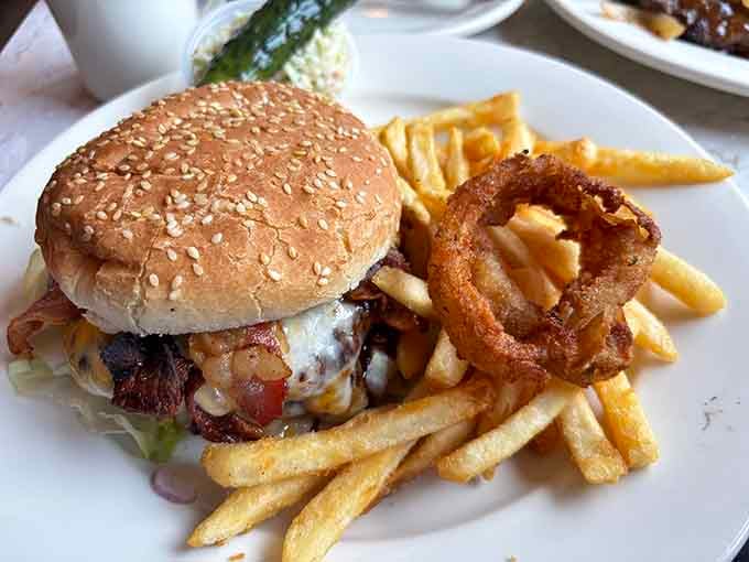 That burger's got onion rings on top because sometimes more is more, and your cardiologist can wait until Monday.
