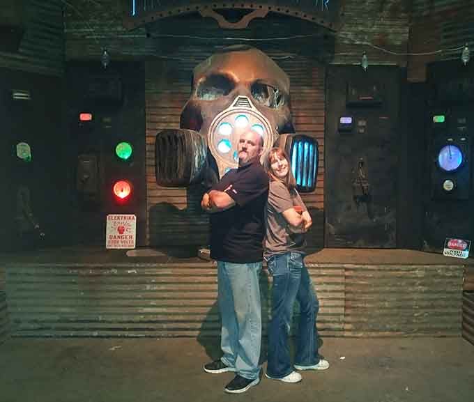 Nothing says "romantic photo op" quite like a giant skull and impending doom behind you.