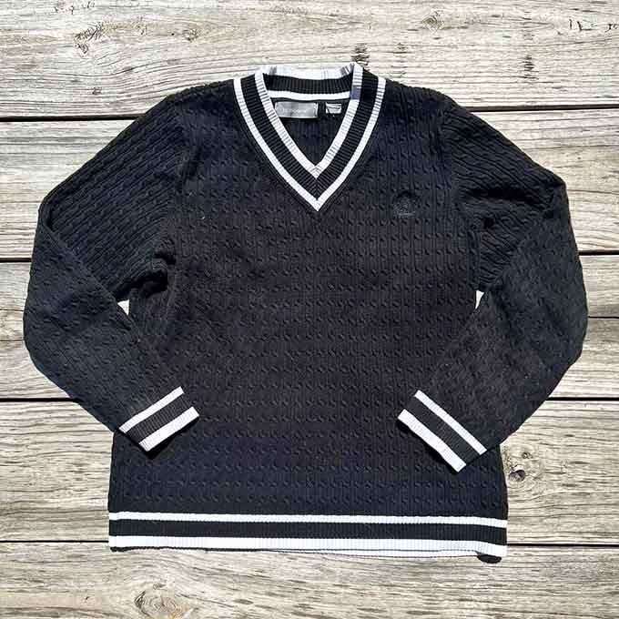 This classic cable-knit sweater with varsity stripes looks ready for a country club mixer or Saturday morning pancakes.