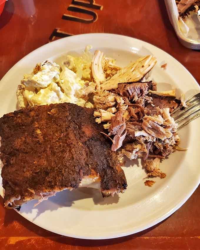 That perfectly sliced brisket with its smoke ring showing proves patience and low heat create pure magic.