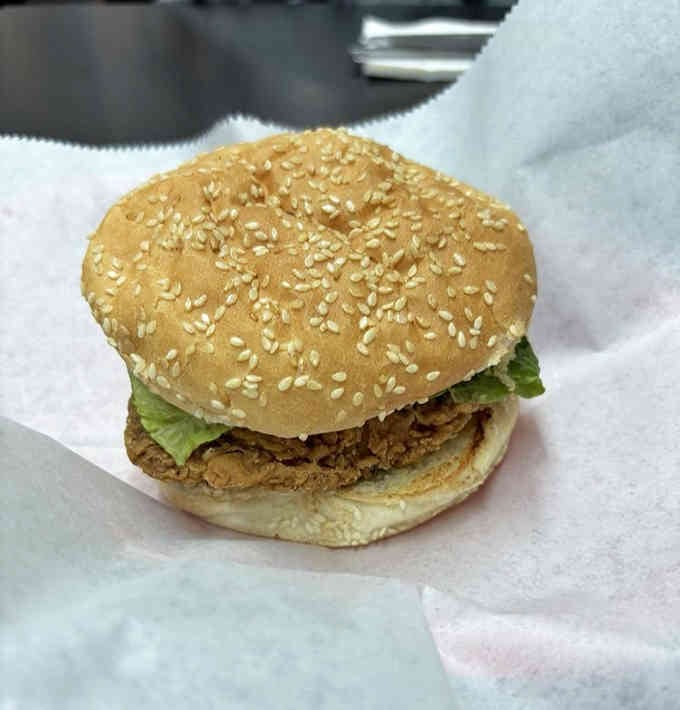 That sesame seed bun holds a fried chicken sandwich that'll make you forget every other sandwich ever existed.