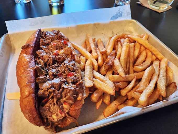 That cheesesteak comes loaded and ready, with fries piled high enough to share, though you probably won't want to.