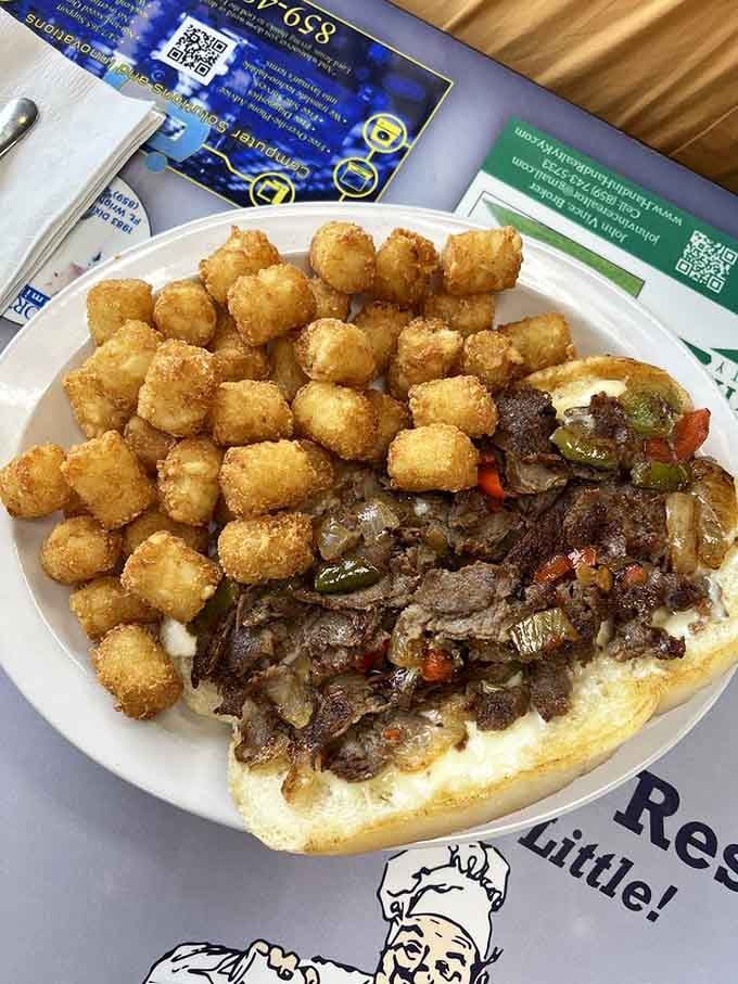 When your Philly cheesesteak comes with tater tots, you know someone in that kitchen truly understands happiness.
