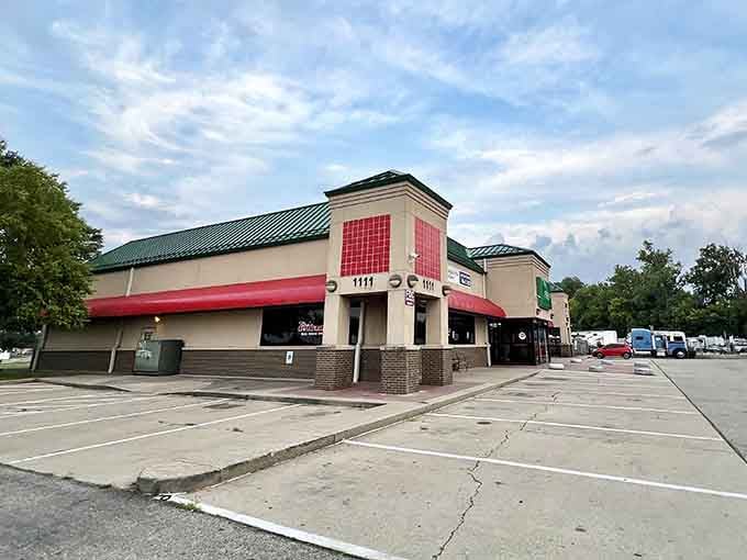 Red awnings pop against neutral tones at this shopping plaza where parking spaces outnumber the stress level considerably.