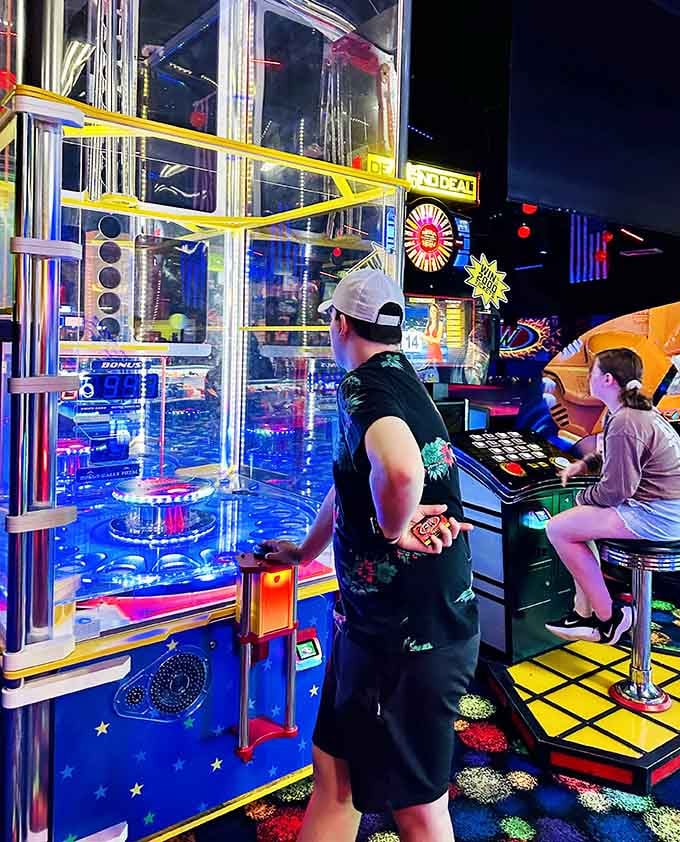 That ticket tower glows like a beacon of hope for anyone dreaming of winning the giant stuffed bear.