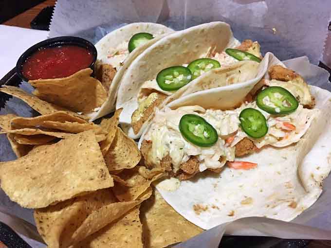 Fish tacos topped with jalape&ntilde;os and slaw, because sometimes fusion just works without trying too hard.