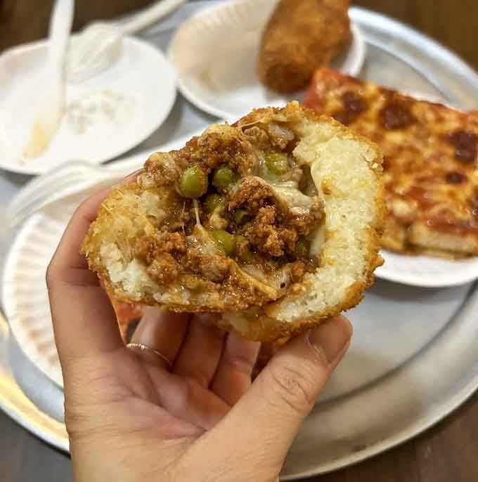 Crispy on the outside, creamy on the inside, this arancini is basically a hug in fried rice ball form.