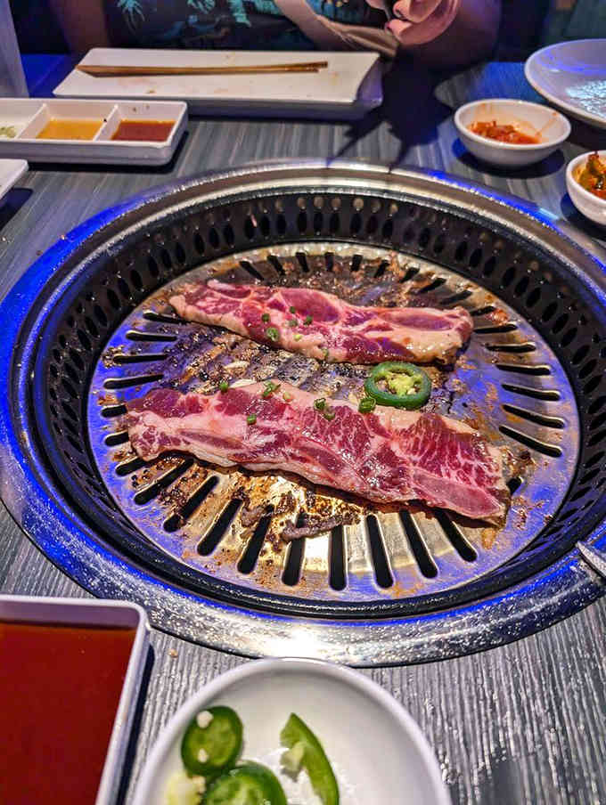 Short ribs marbling beautifully on the grill, proving that good things come to those who cook their own dinner.