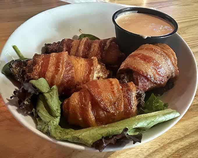 Bacon-wrapped jalape&ntilde;o poppers that bring the heat like your favorite 80s action hero brought the one-liners.