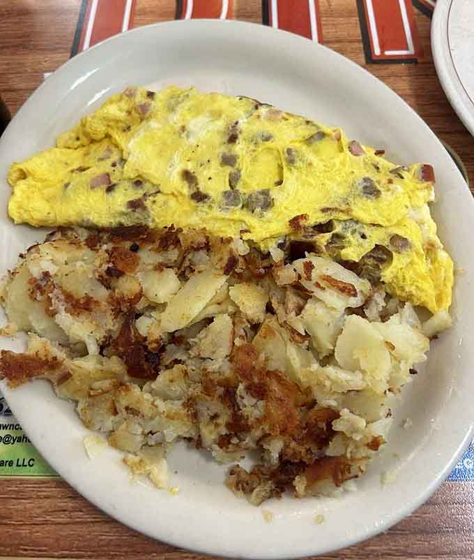 The Meat Lovers Omelet with golden hashbrowns is basically a love letter to anyone who takes breakfast seriously.