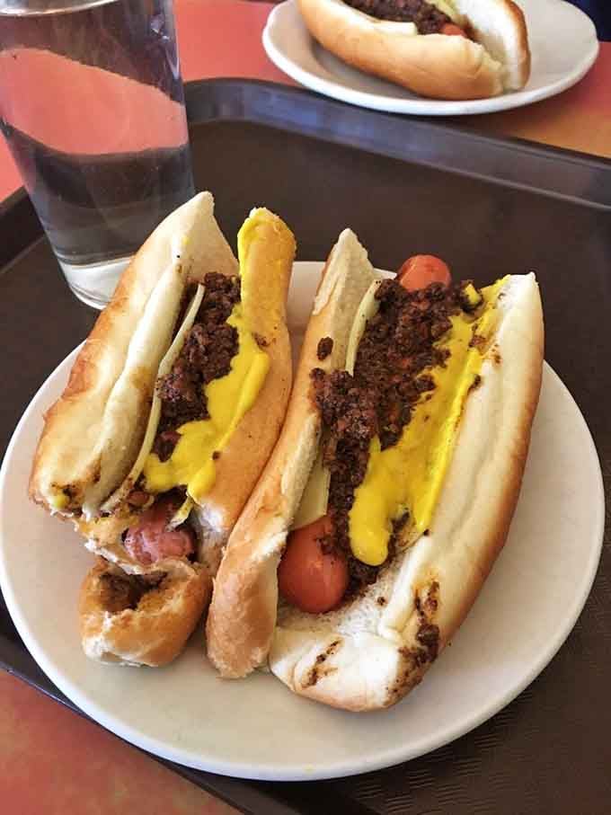 When "The Works" means business: mustard, chili, and enough toppings to require both hands and zero regrets about your lunch plans.